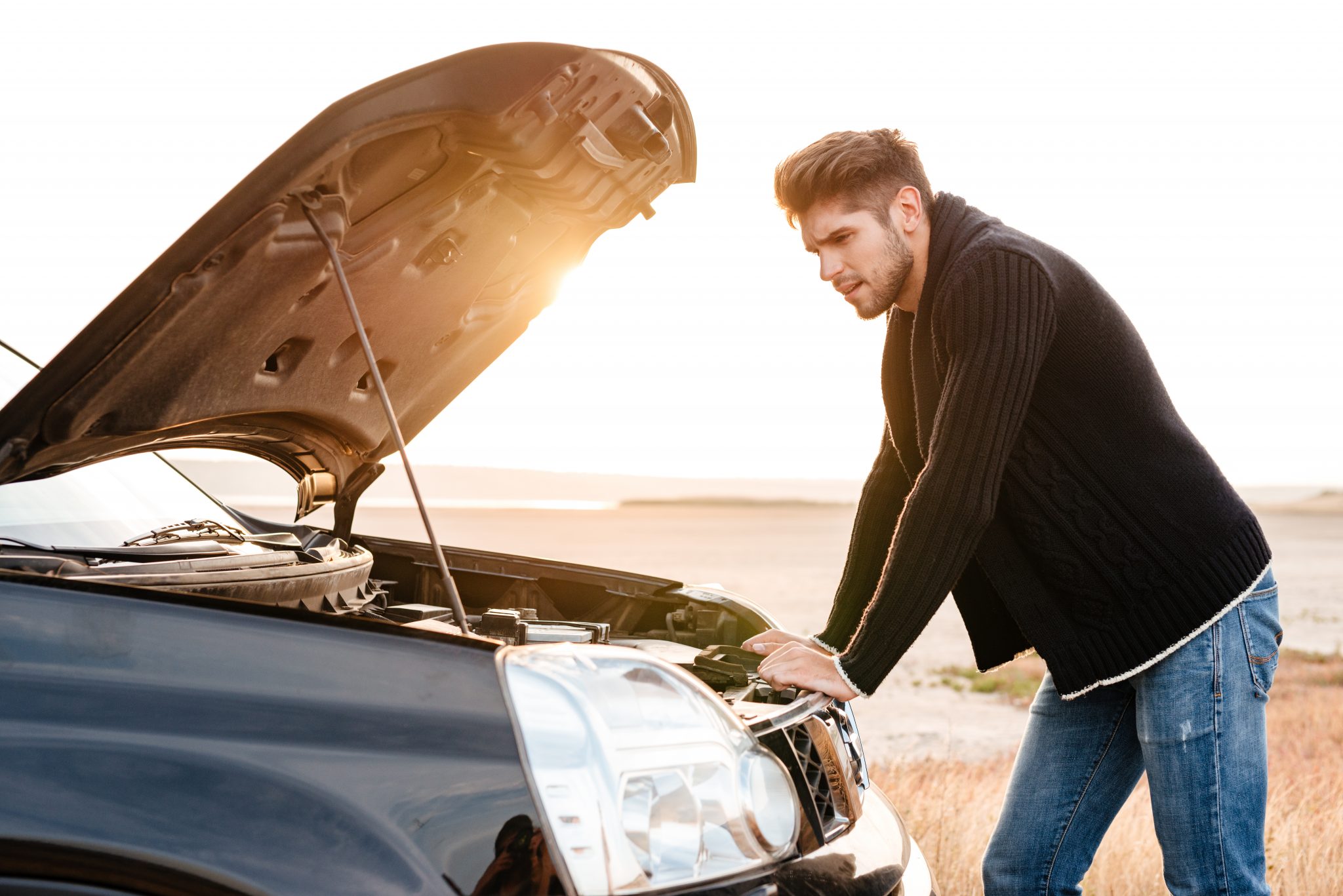 Young casual man trying to fix his broken car - The Gospel Coalition ...